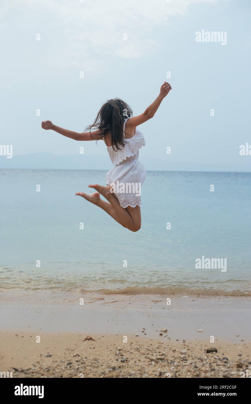 Barefoot woman white dress hi-res stock photography and images - Alamy