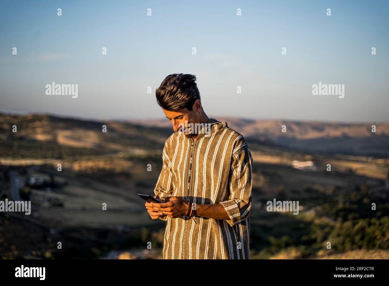 Muslim man mobile phone in hi-res stock photography and images - Alamy