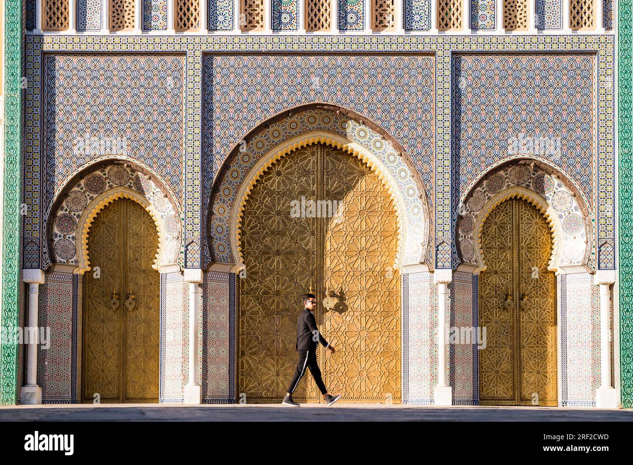 Moroccan man with sunglasses and suit next to Royal Palace in Fe Stock ...