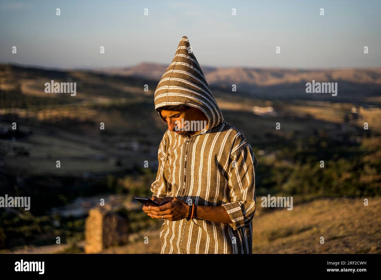 Muslim man mobile phone in hi-res stock photography and images - Alamy