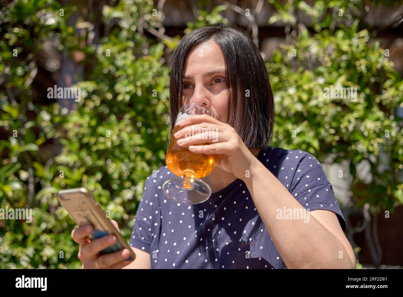 Drinking beer sitting on street hi-res stock photography and images - Alamy