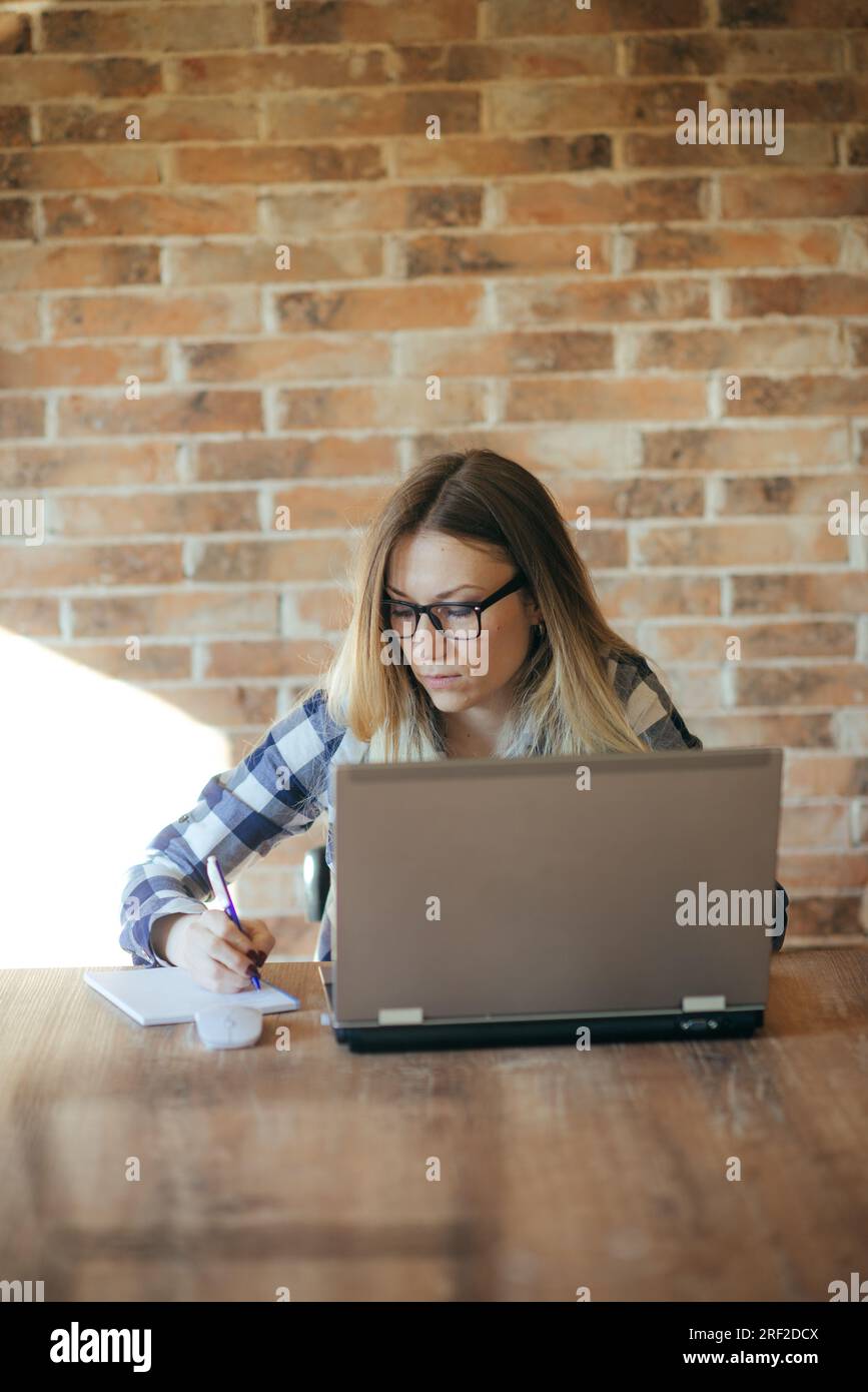 businesswoman writing on her office table Stock Photo - Alamy