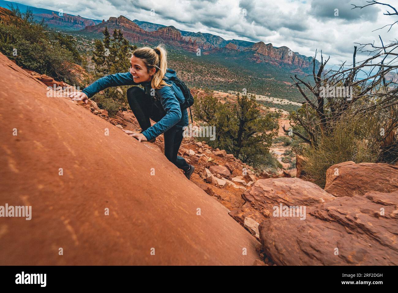 Runner climbing rock athlete hi-res stock photography and images - Alamy