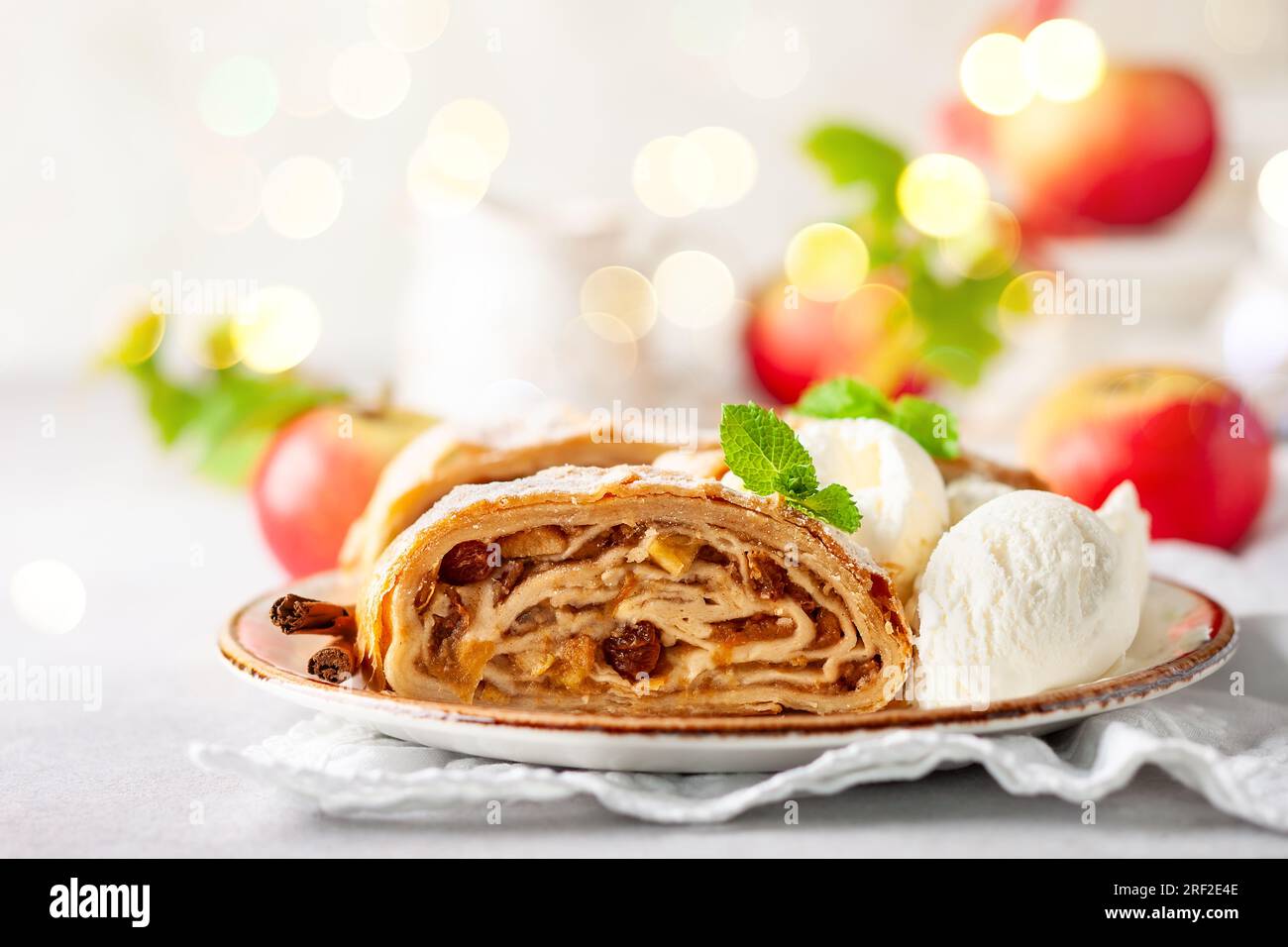 Traditional pieces of apple strudel with cinnamon,raisin, powdered ...