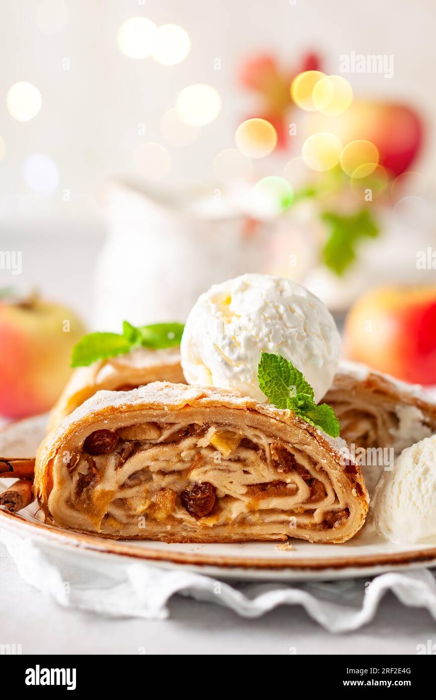 Traditional pieces of apple strudel with cinnamon,raisin, powdered ...
