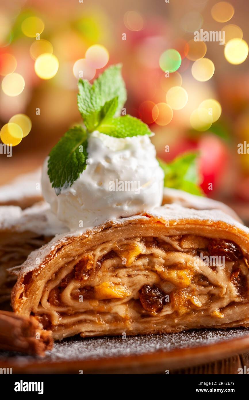 Traditional pieces of apple strudel with cinnamon,raisin, powdered ...