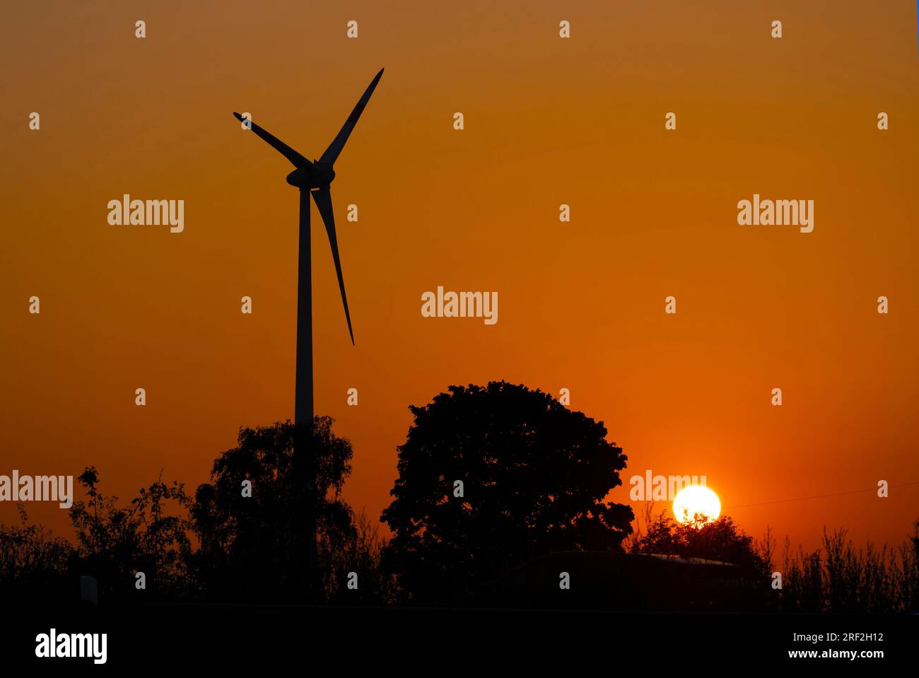 Wind engines at sunset hi-res stock photography and images - Alamy