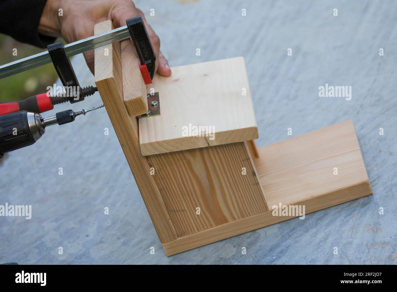 making a feeder for squirrels, step 7: water drainage channel is fixed ...