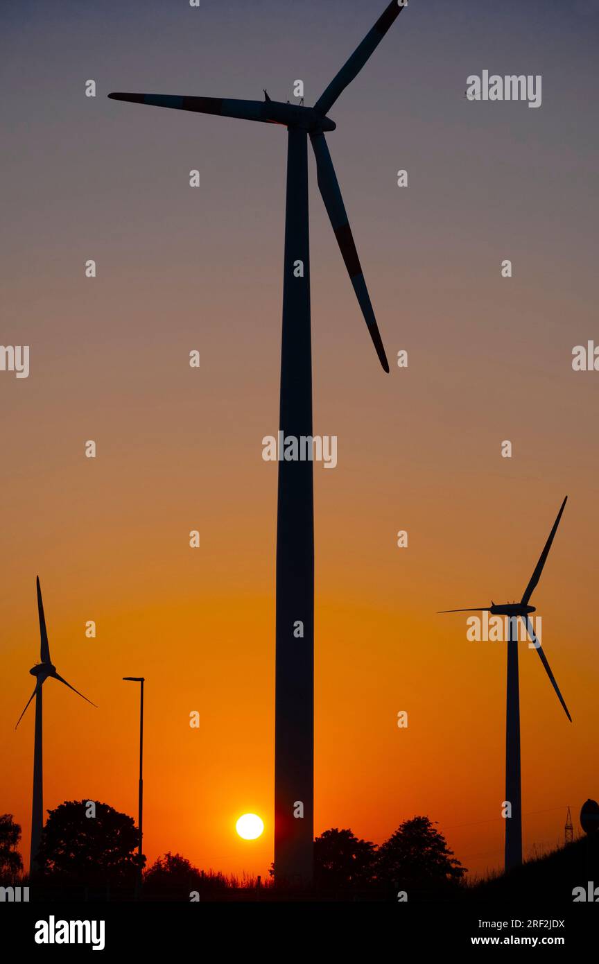 wind wheels at sunset, Germany Stock Photo - Alamy