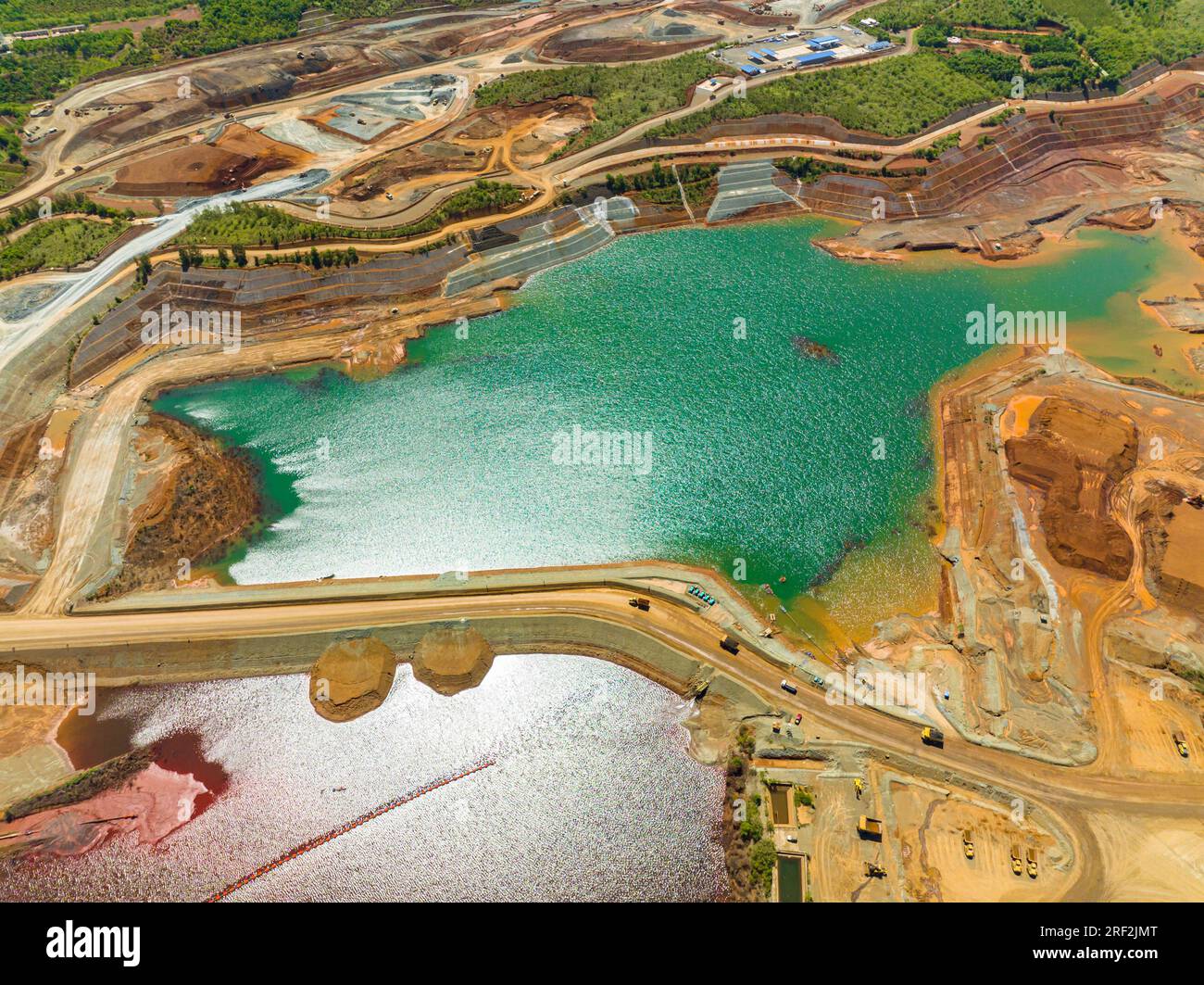 Polluted lake of nickel mining. Turquoise and red water. Mindanao ...