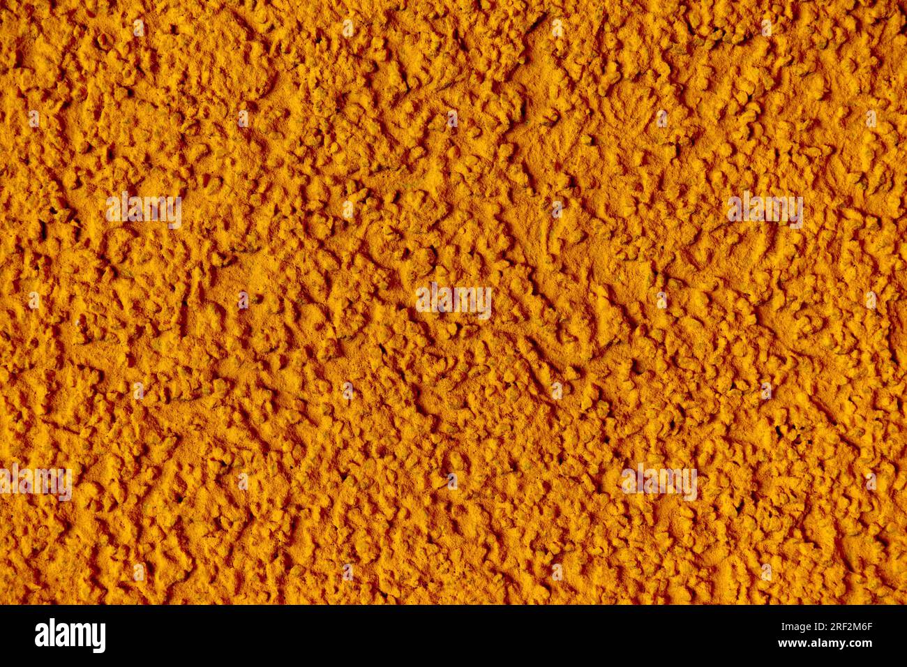 Texture of the orange insulated wall with a rough cast plaster finish ...