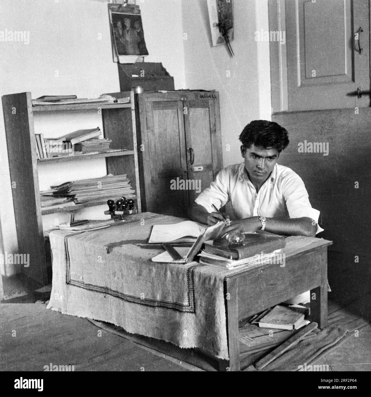 old vintage 1900s black and white picture of man working sitting ...