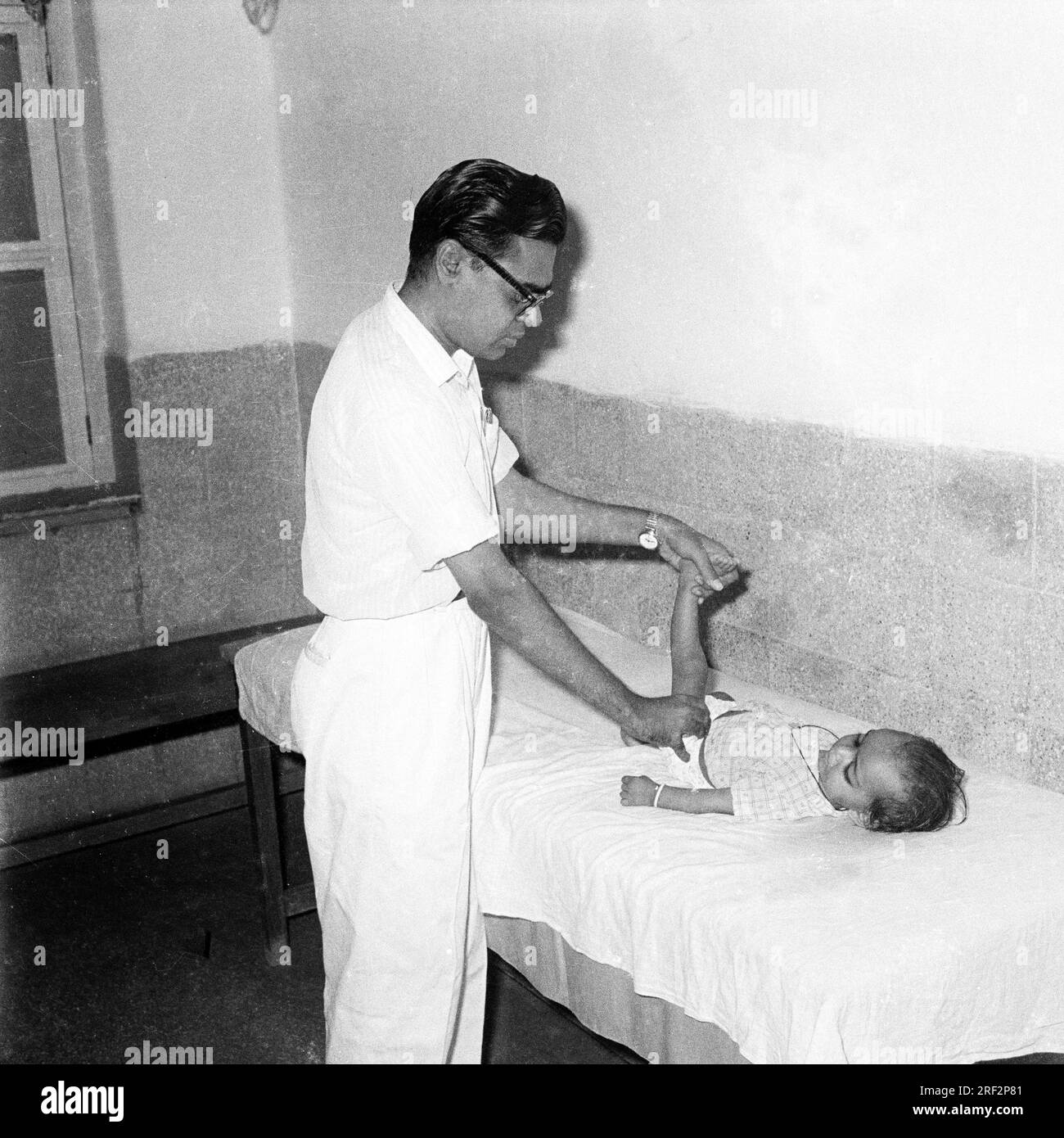 old vintage 1900s black and white picture of Indian Doctor checking ...