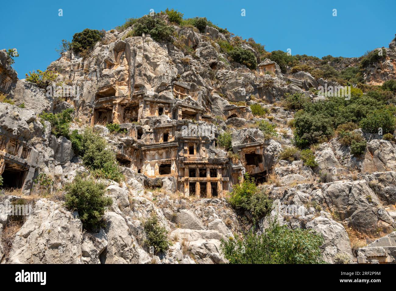 The ruins of the amphitheater and ancient rock tombs in the ancient ...