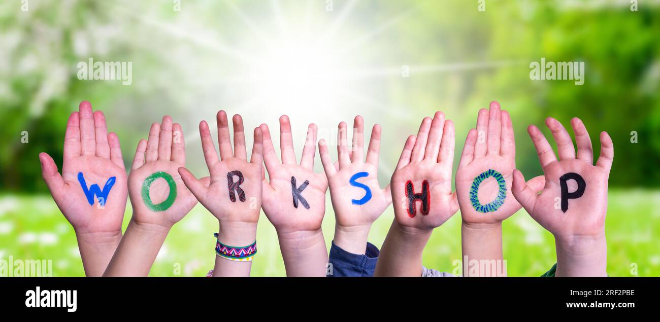 Children Hands Building Word Workshop, Grass Meadow Stock Photo - Alamy