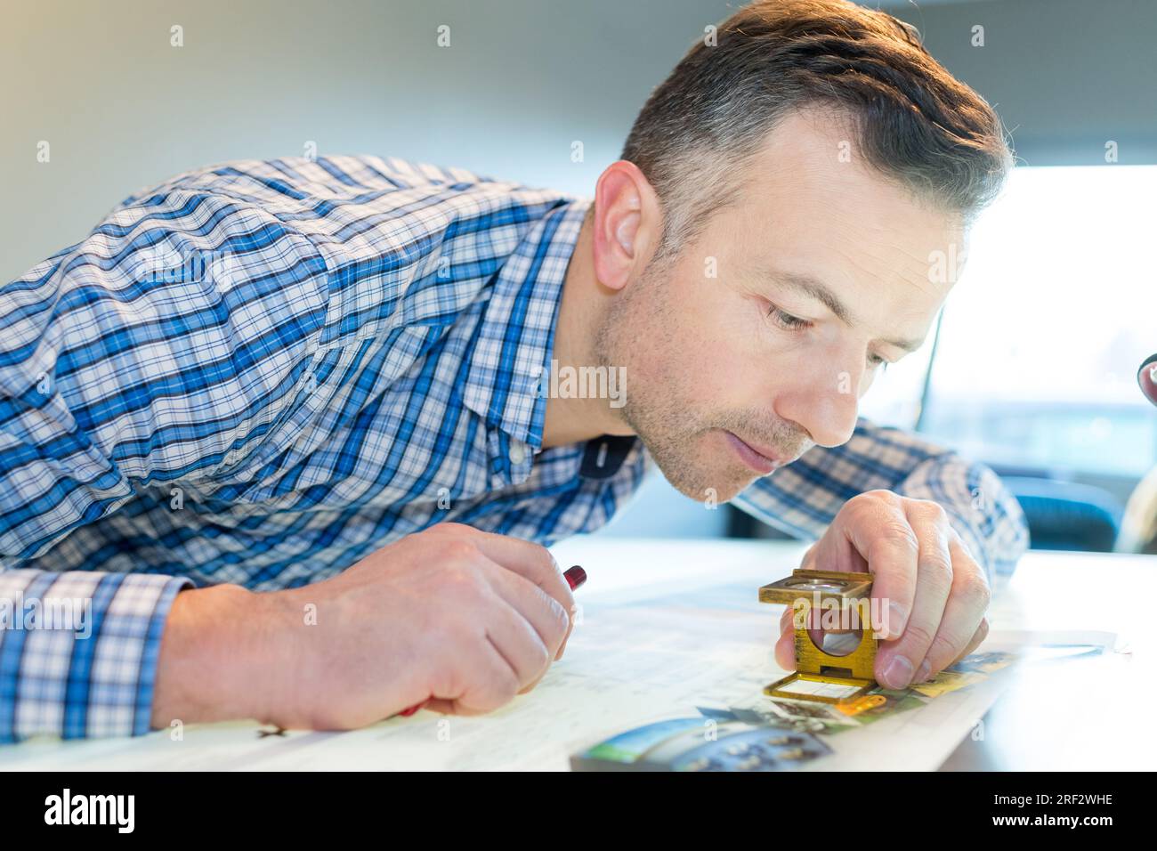 Printing industry magnifying glass hi-res stock photography and images ...