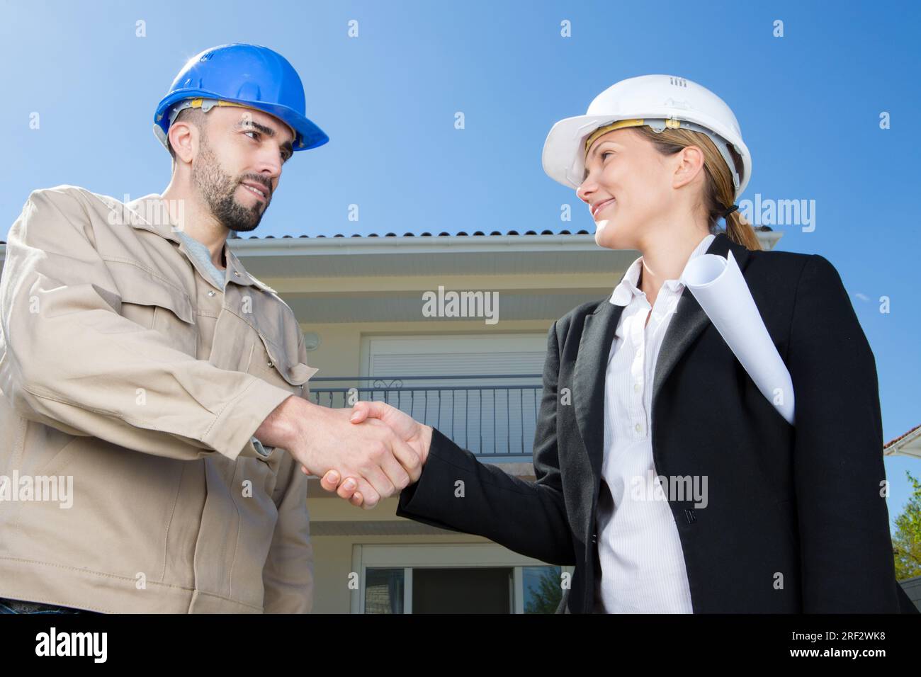 man and women engineer handshake Stock Photo - Alamy