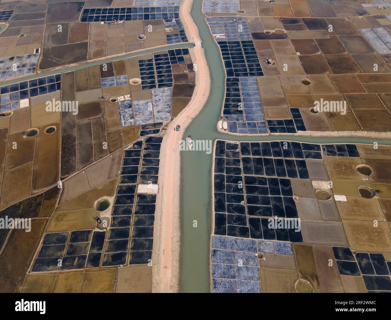An aerial view of a natural salt field in the large area of the ...