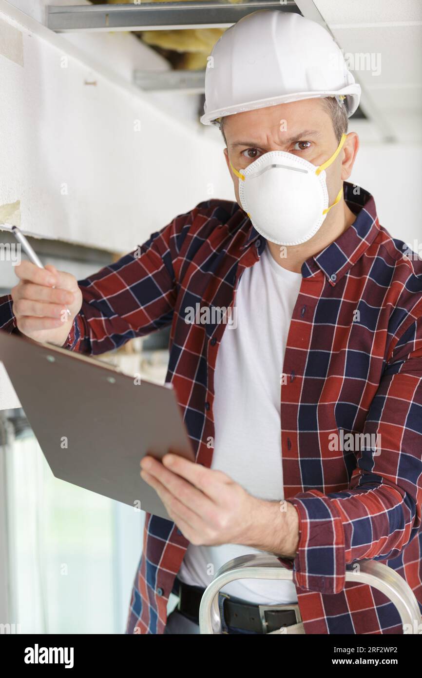 engineer writing something with a pen Stock Photo - Alamy