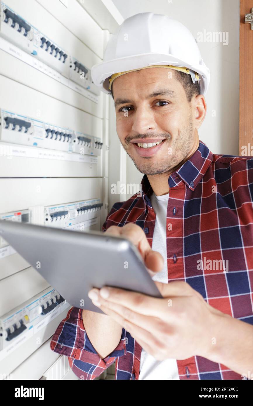 Male technician examining fusebox hi-res stock photography and images ...