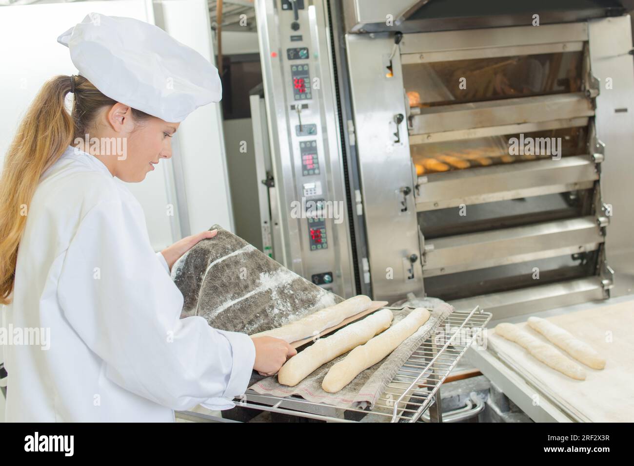 Female baker standing behind hi-res stock photography and images - Alamy