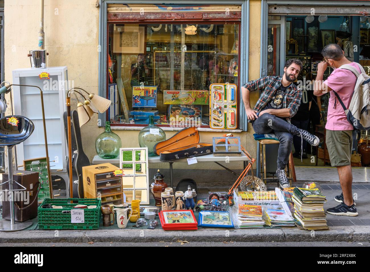 Antiques and bric-a-brac on sale in the Rastro flea market around the ...