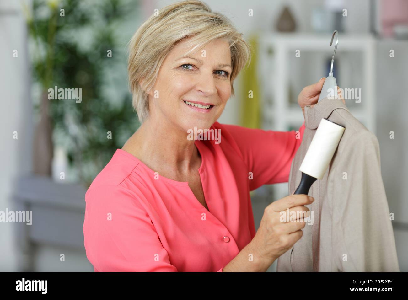 Woman removing adhesive tape from hi-res stock photography and images ...
