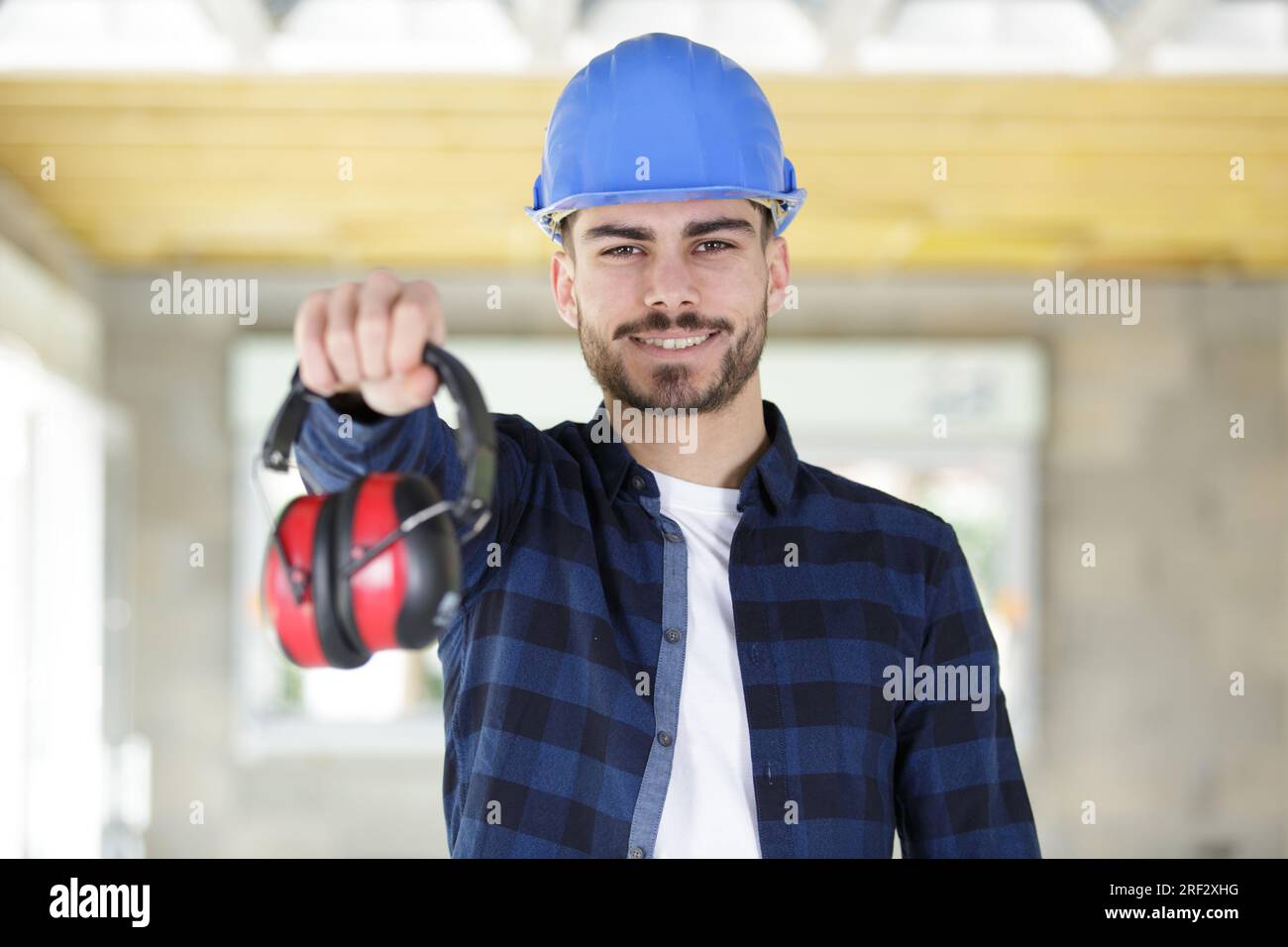 Yellow wear hearing protection hi-res stock photography and images - Alamy