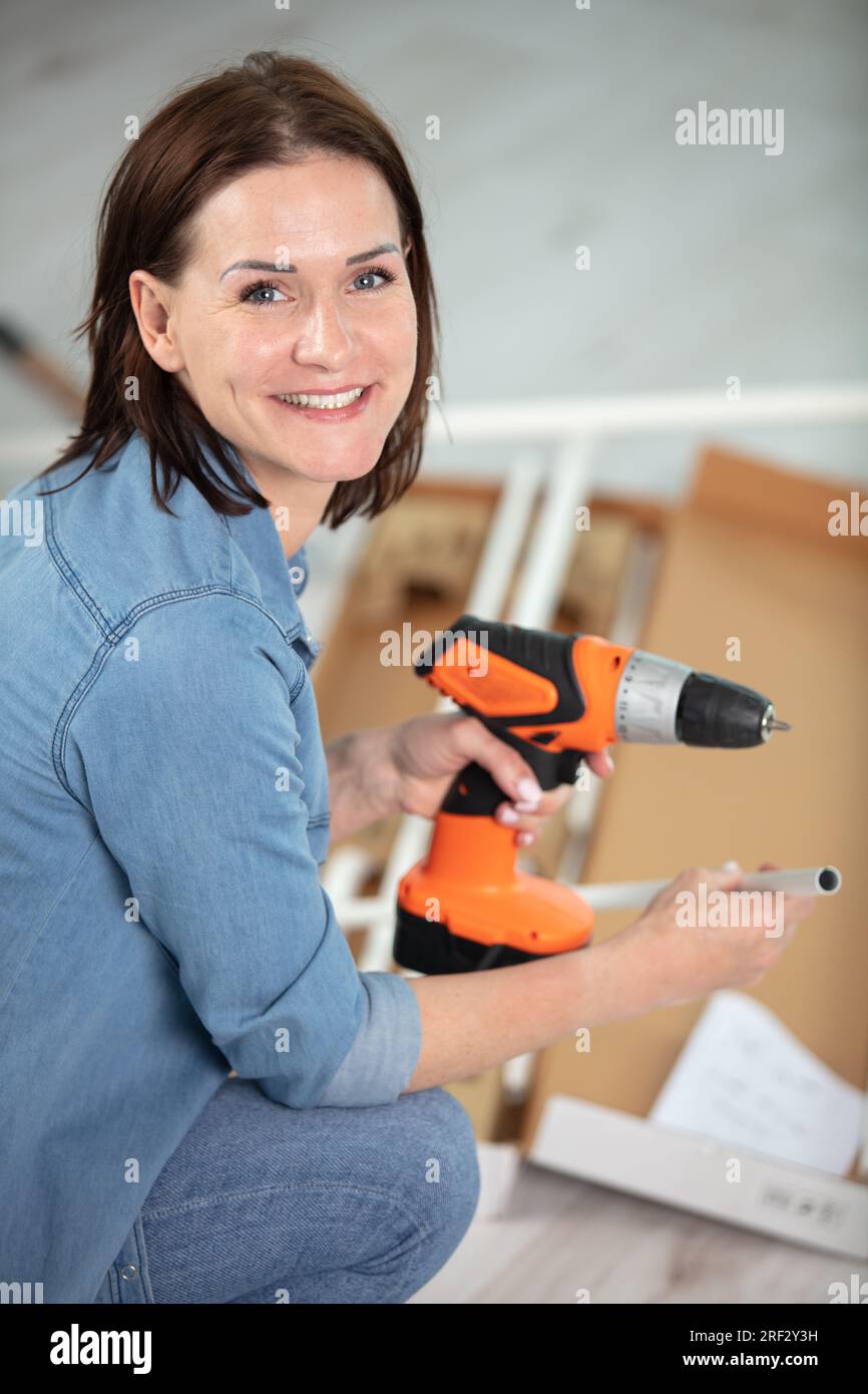 Happy tradesman holding plank wood hi-res stock photography and images ...