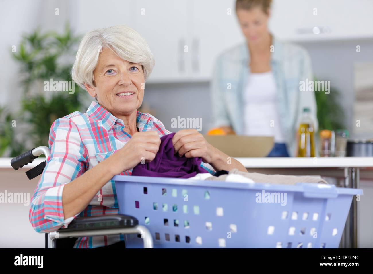 elderly disabled woman sorting laundry Stock Photo - Alamy elderly disabled woman sorting laundry Stock Photo - Alamy