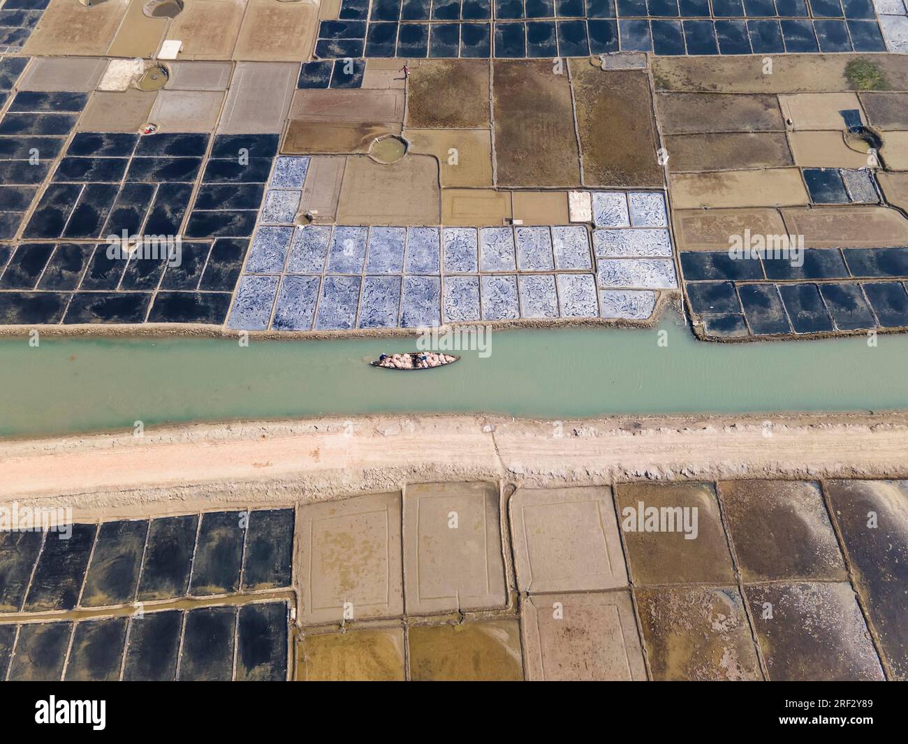 An aerial view of a natural salt field in the large area of the ...