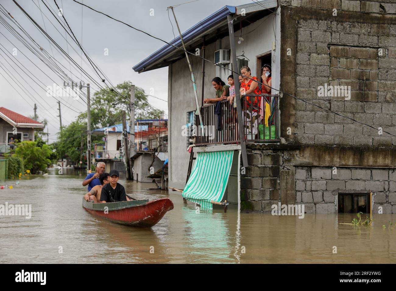 Calumpit, Bulacan, Philippines. 31st July, 2023. Residents use boats as ...