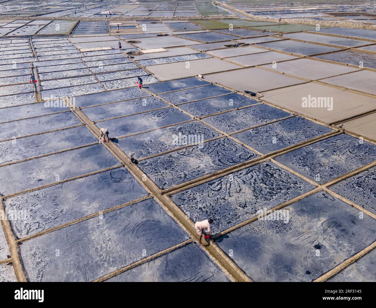 An aerial view of a natural salt field in the large area of the ...