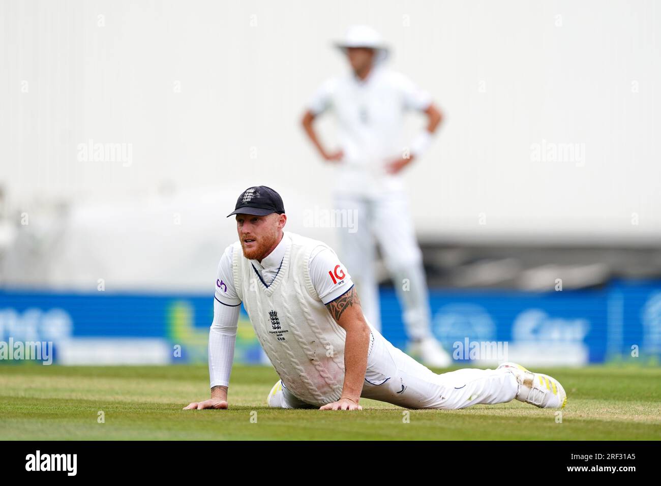 England's Ben Stokes looks on after trying to claim the ball with ...