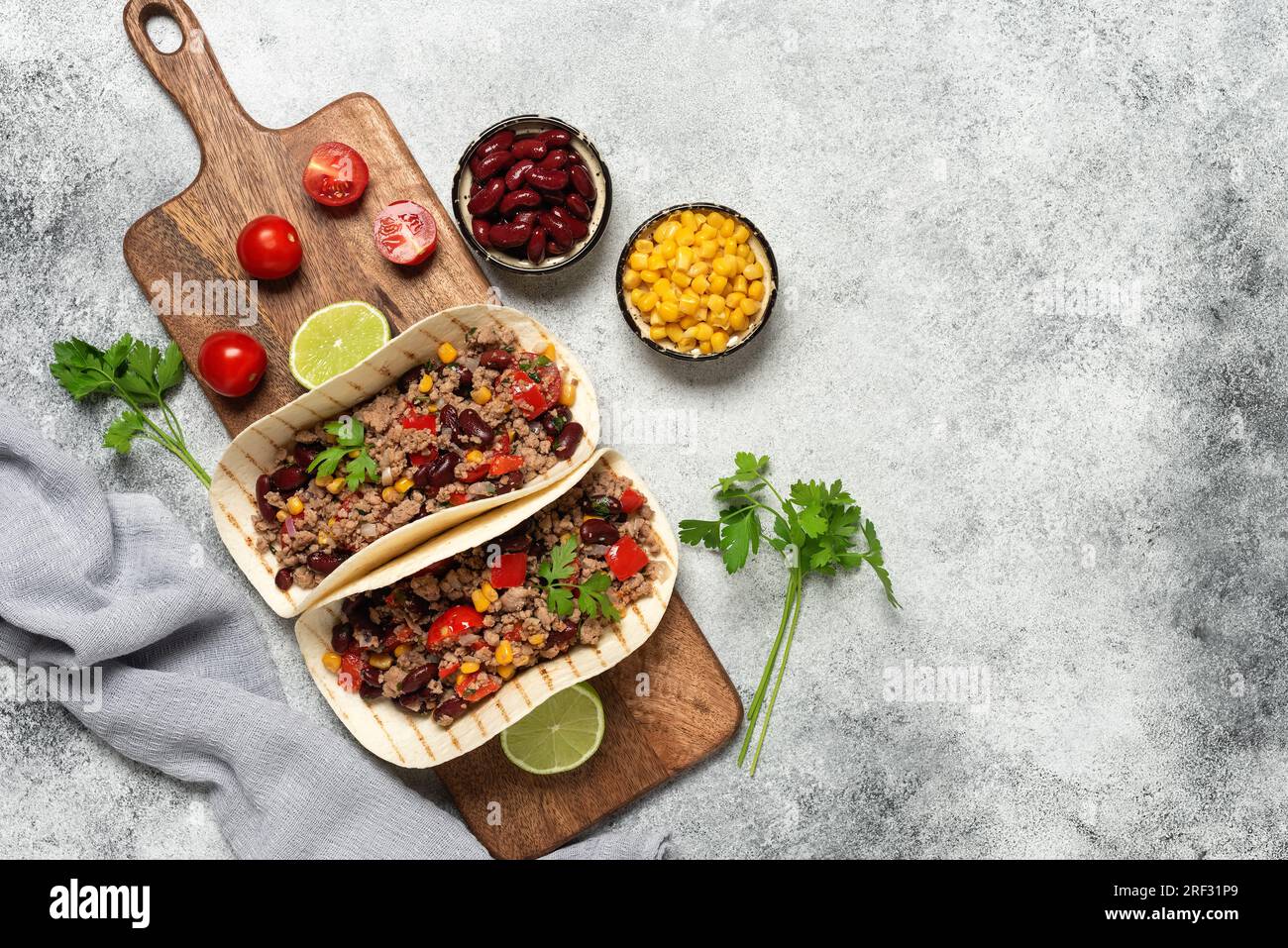 Mexican tacos with beef. Tacos with ground beef, beans, corn and tomato ...