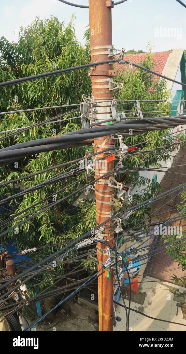 Electric poles and cables seen from below against the sky Stock Photo ...