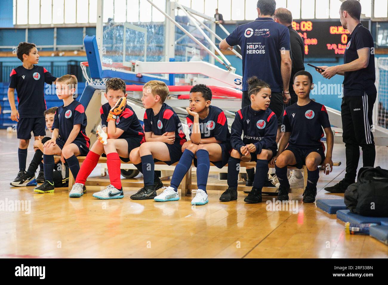 Girls playing football at a futsal tournament Stock Photo - Alamy