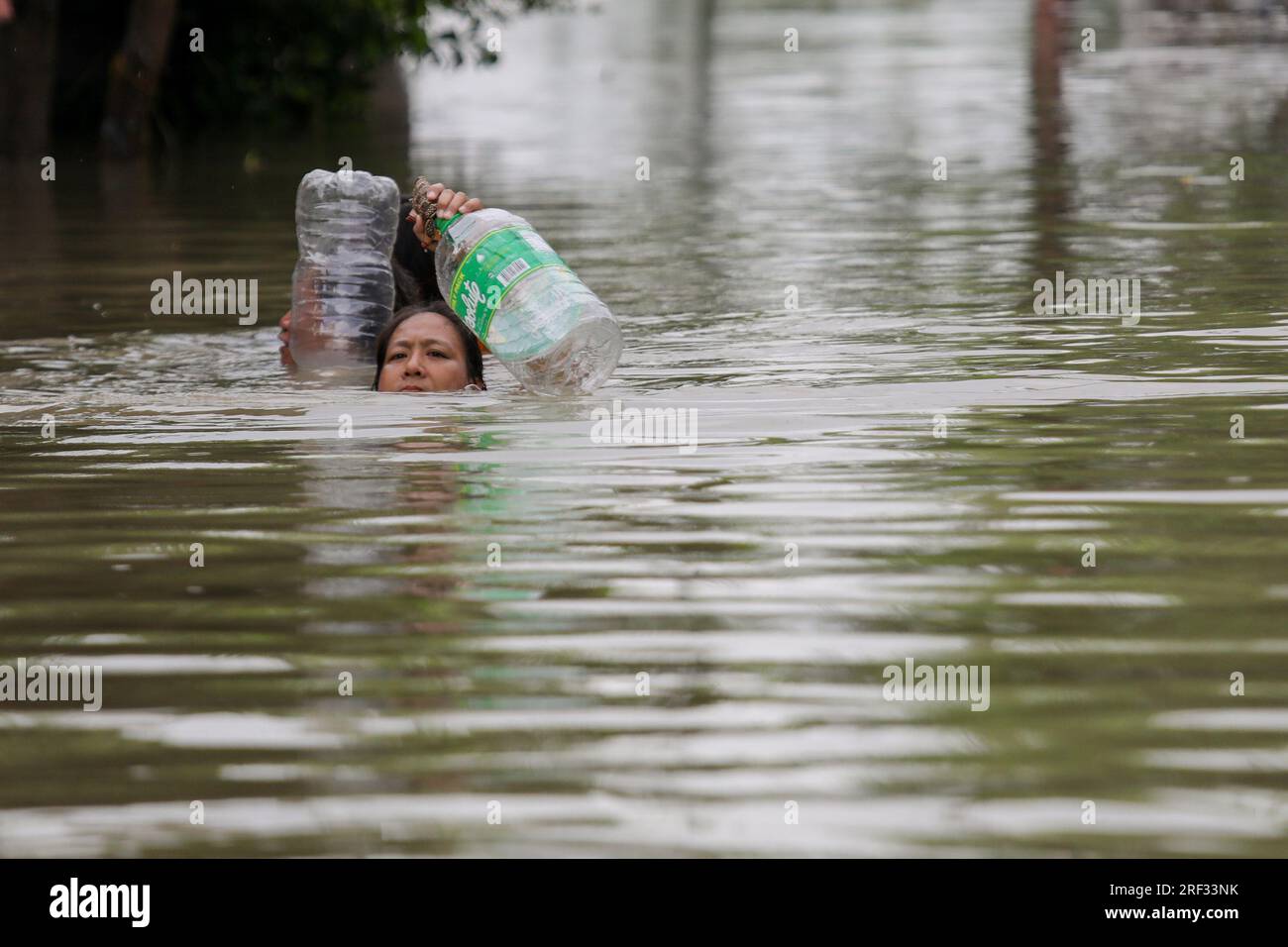Calumpit, Bulacan, Philippines. 31st July, 2023. Residents use plastic ...