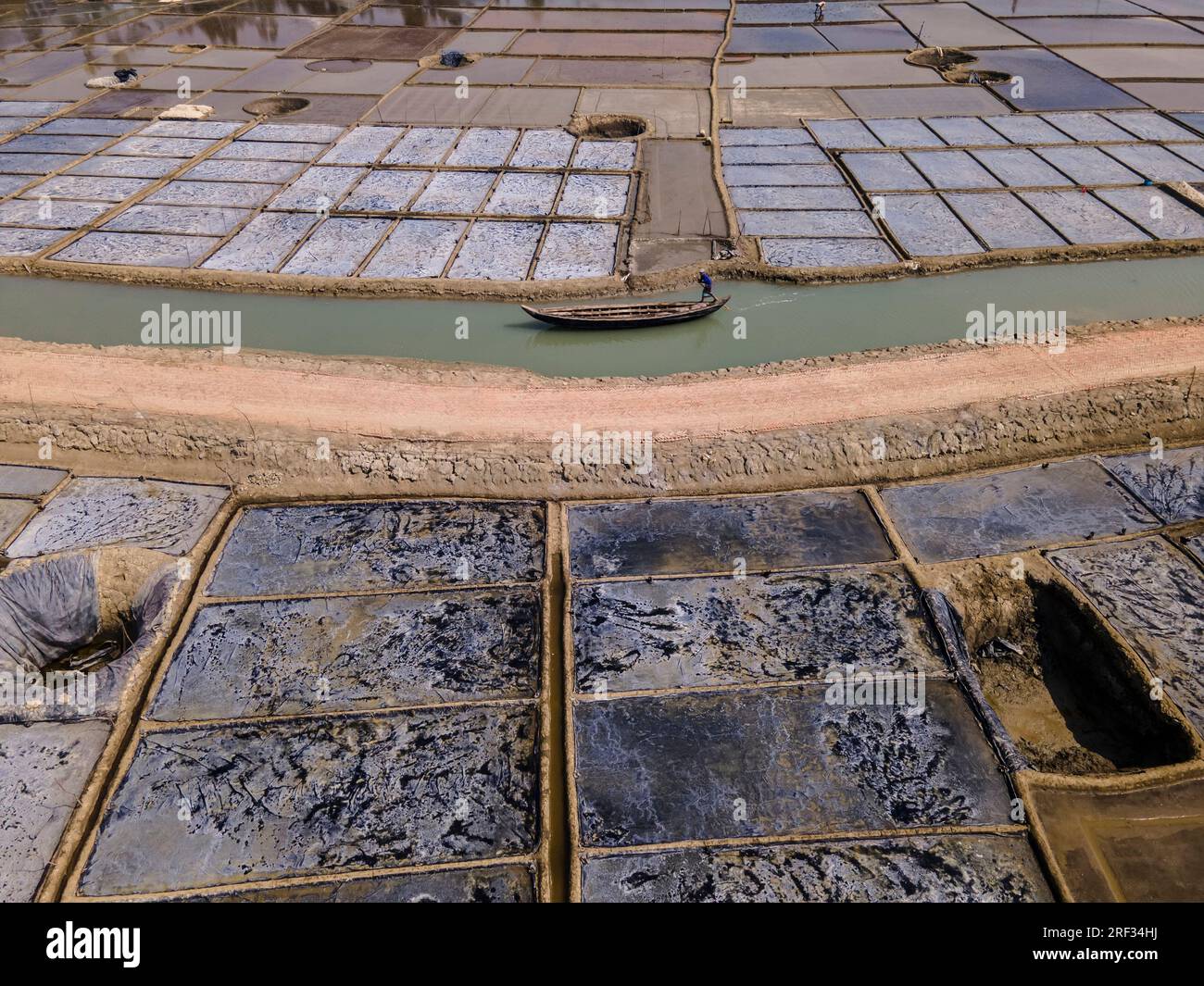 An aerial view of a natural salt field in the large area of the ...
