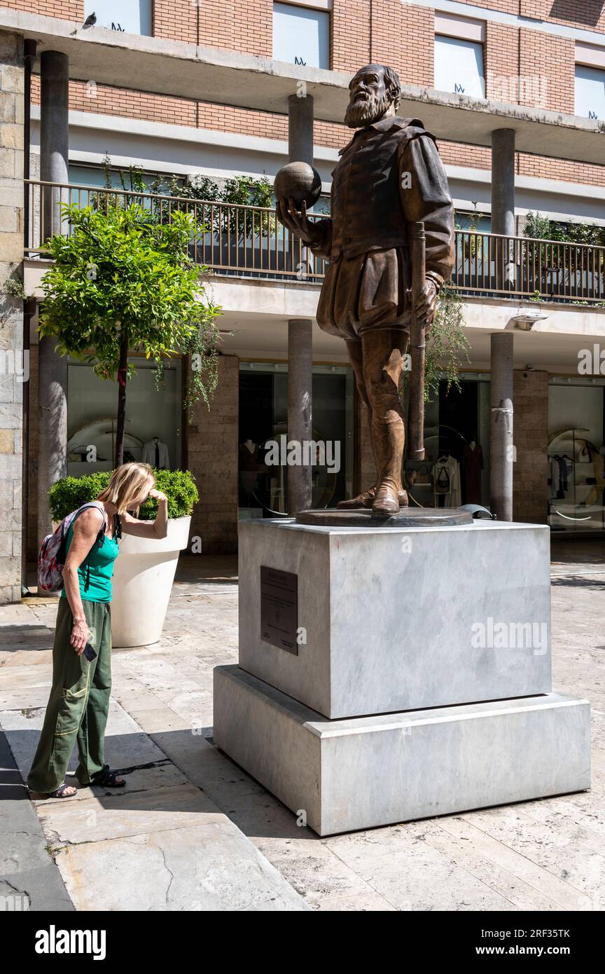 Statue of Italian scientist Galileo Galilei holding a sphere. Galileo ...