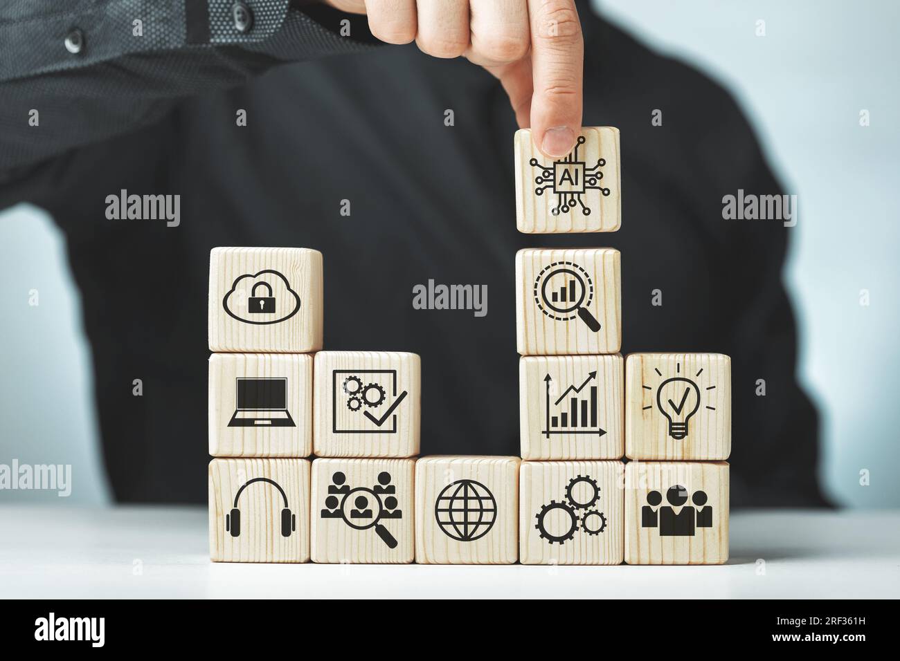 Assembled wooden cubes on the topic of the application of artificial ...