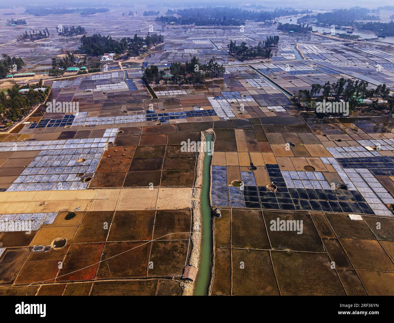 An aerial view of a natural salt field in the large area of the ...