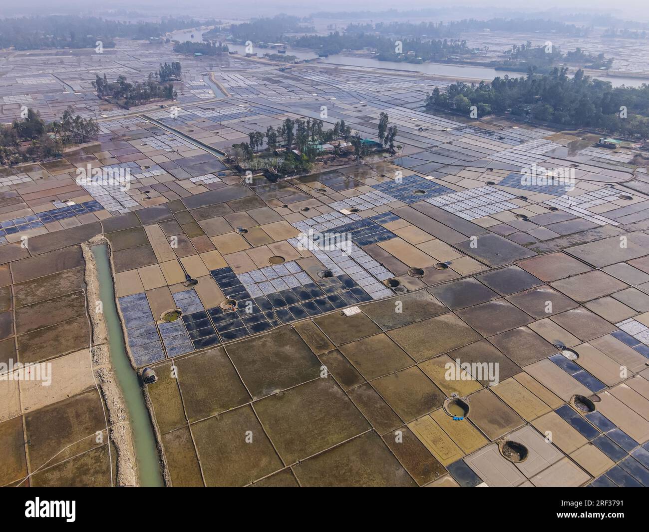 An aerial view of a natural salt field in the large area of the ...