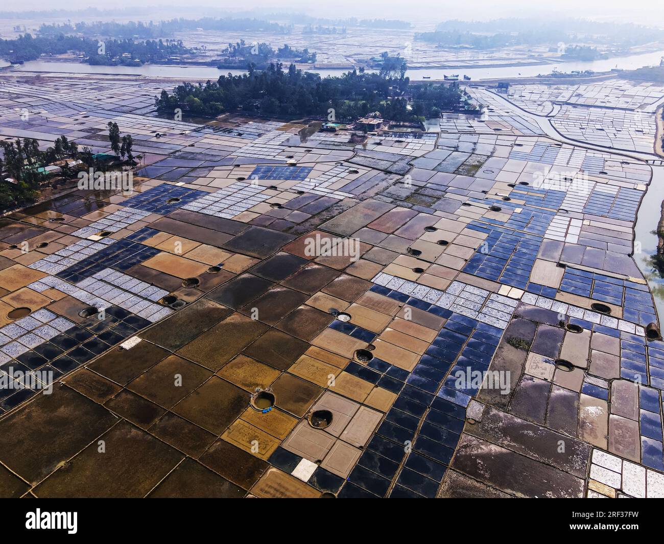 An aerial view of a natural salt field in the large area of the ...
