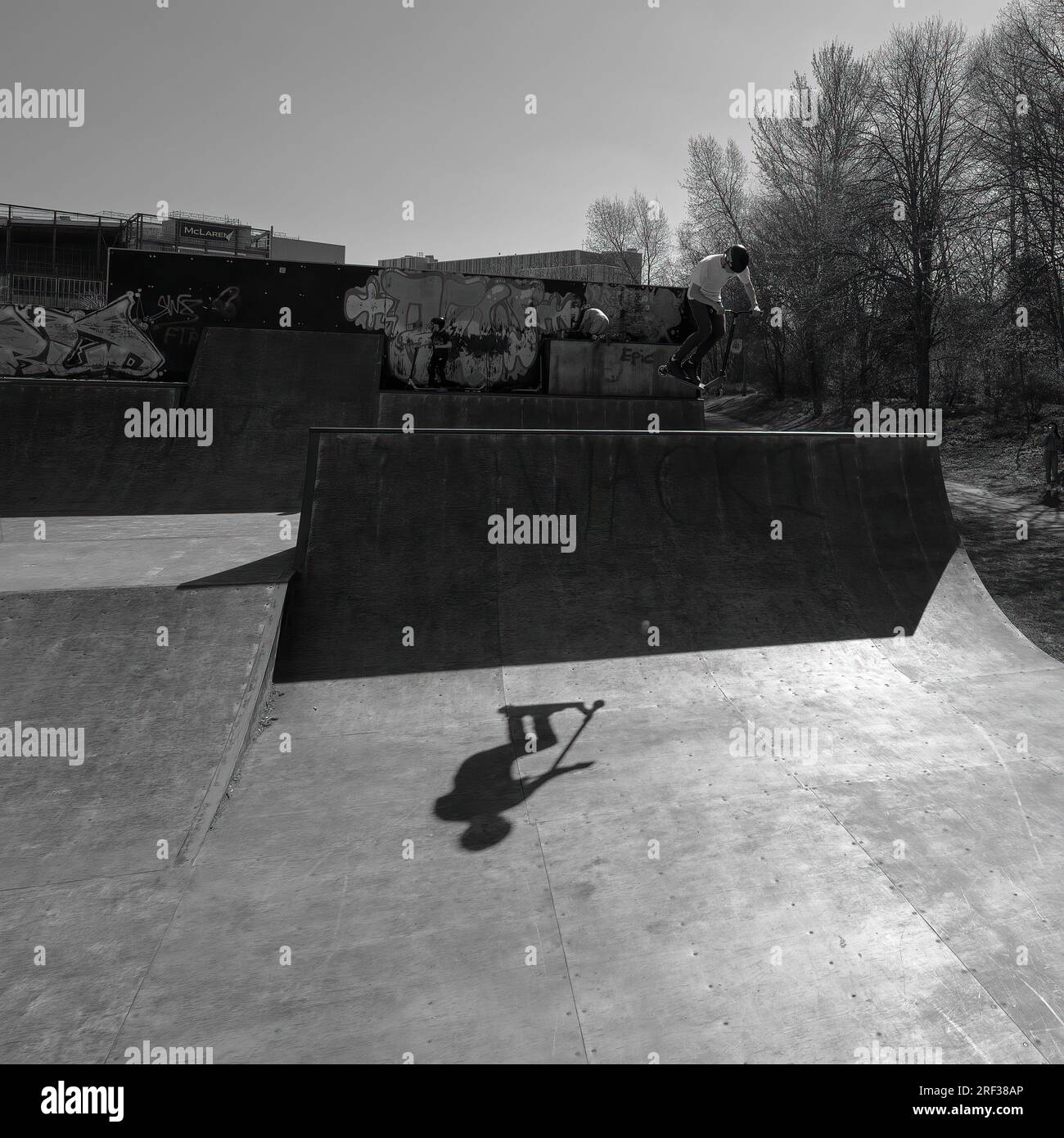 Black and white image of a scooter being ridden at the skatepark Stock ...