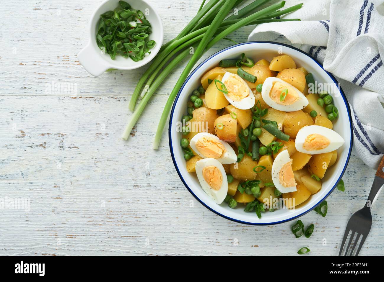 Traditional Potato salad with bacon and eggs in a white bowl. Picnic ...