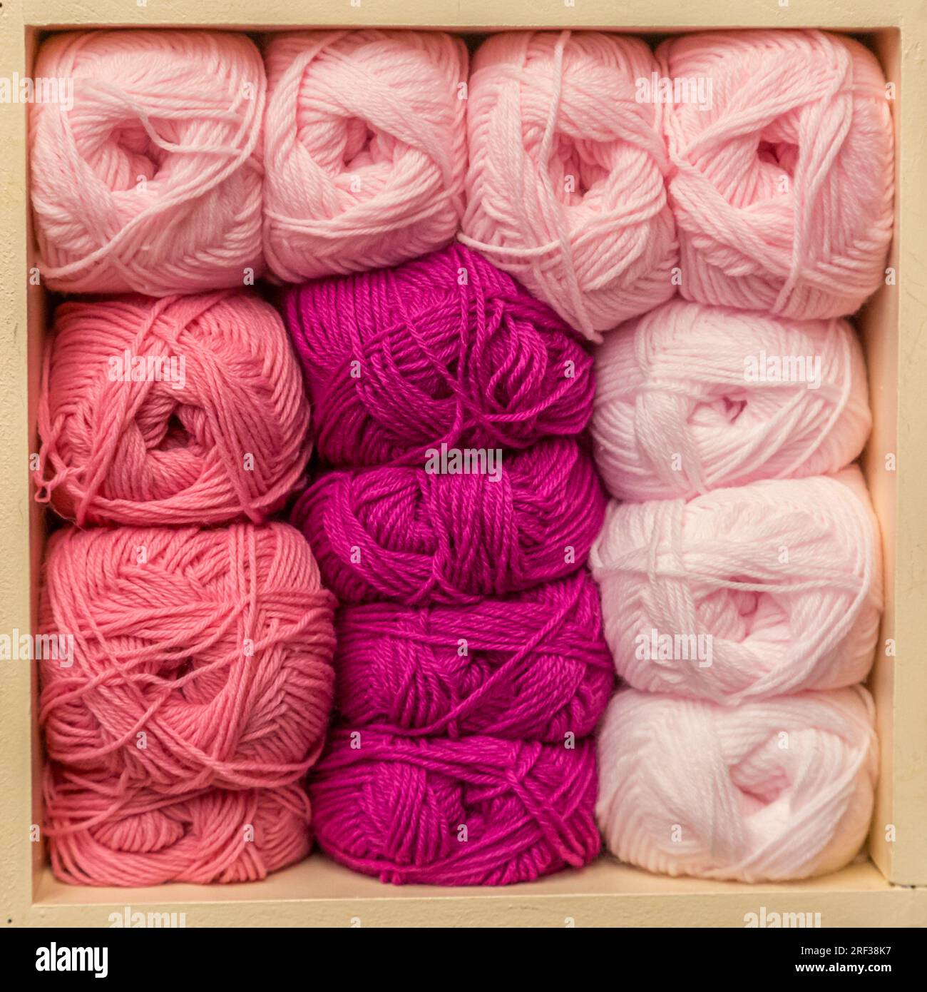 Different shades of pink wool for sale Stock Photo - Alamy