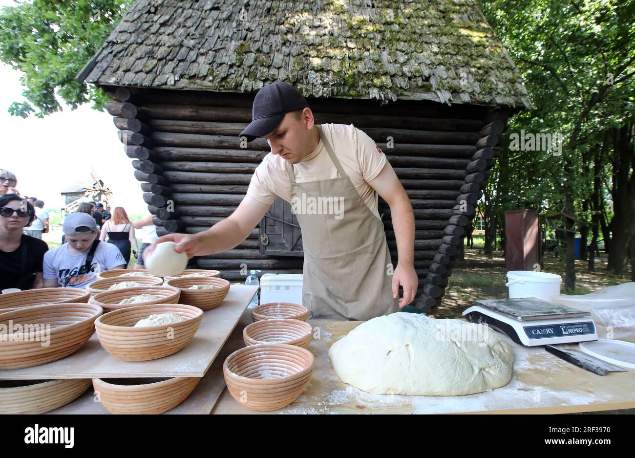 KYIV, UKRAINE - JULY 29, 2023 - An employee of the From Grain to Bread ...