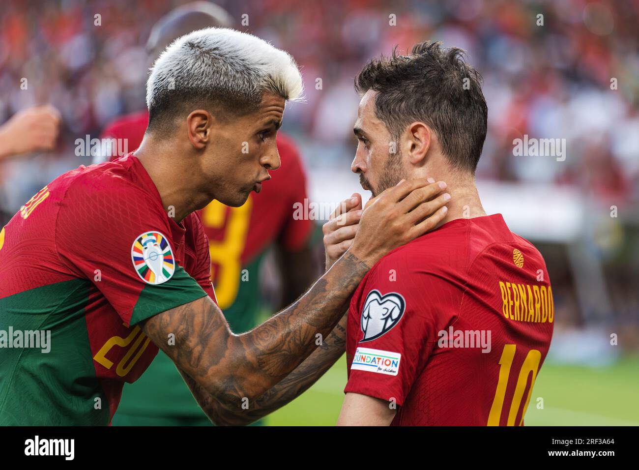 Bernardo Silva and Joao Cancelo celebrate after scored goal during UEFA ...