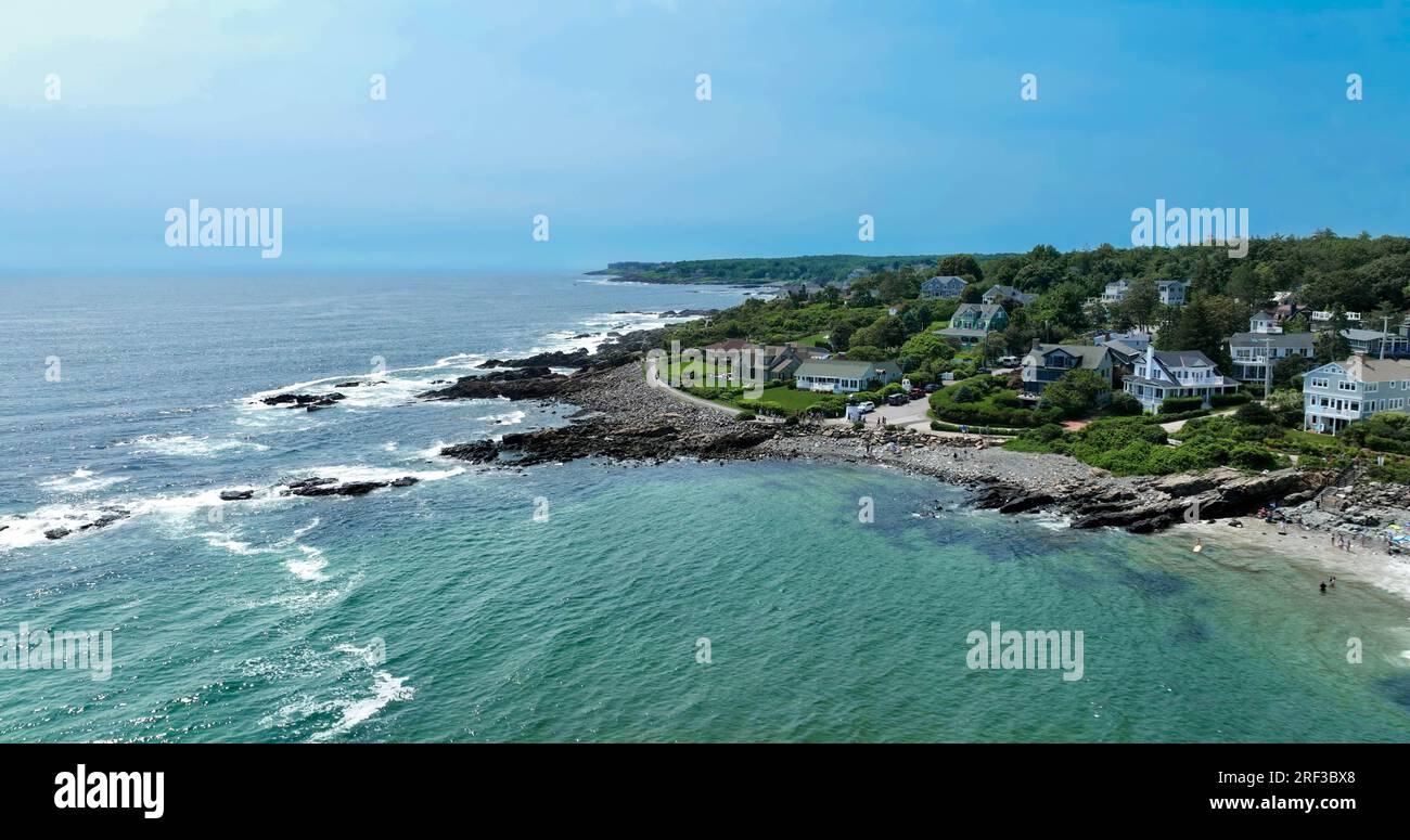 Maine rocky coast with crashing waves and aerial view of marginal way ...
